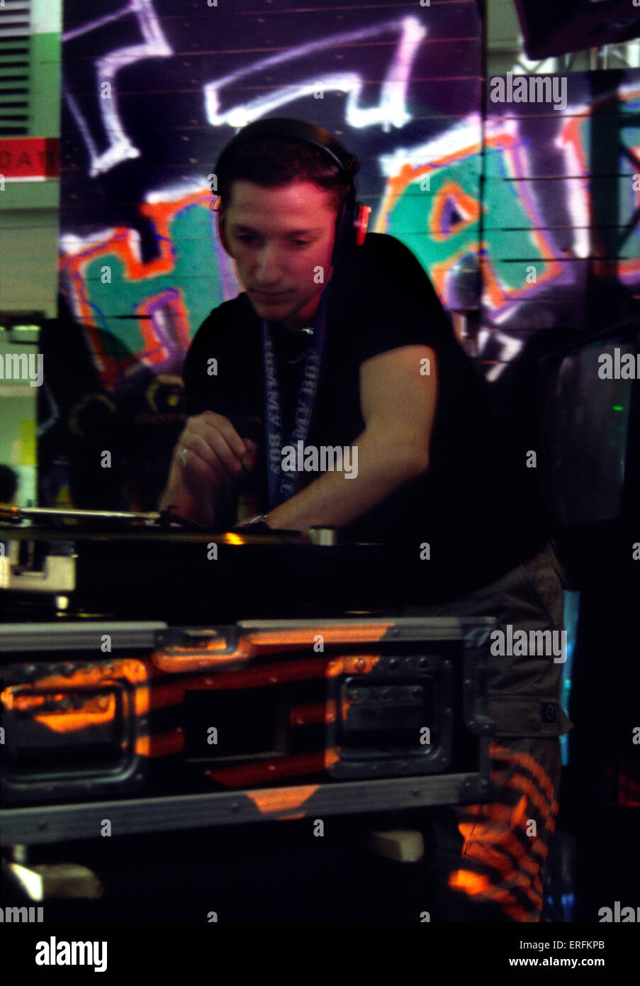 Male DJ playing records in a French disco / club, 2001. Deejay. Disco ...