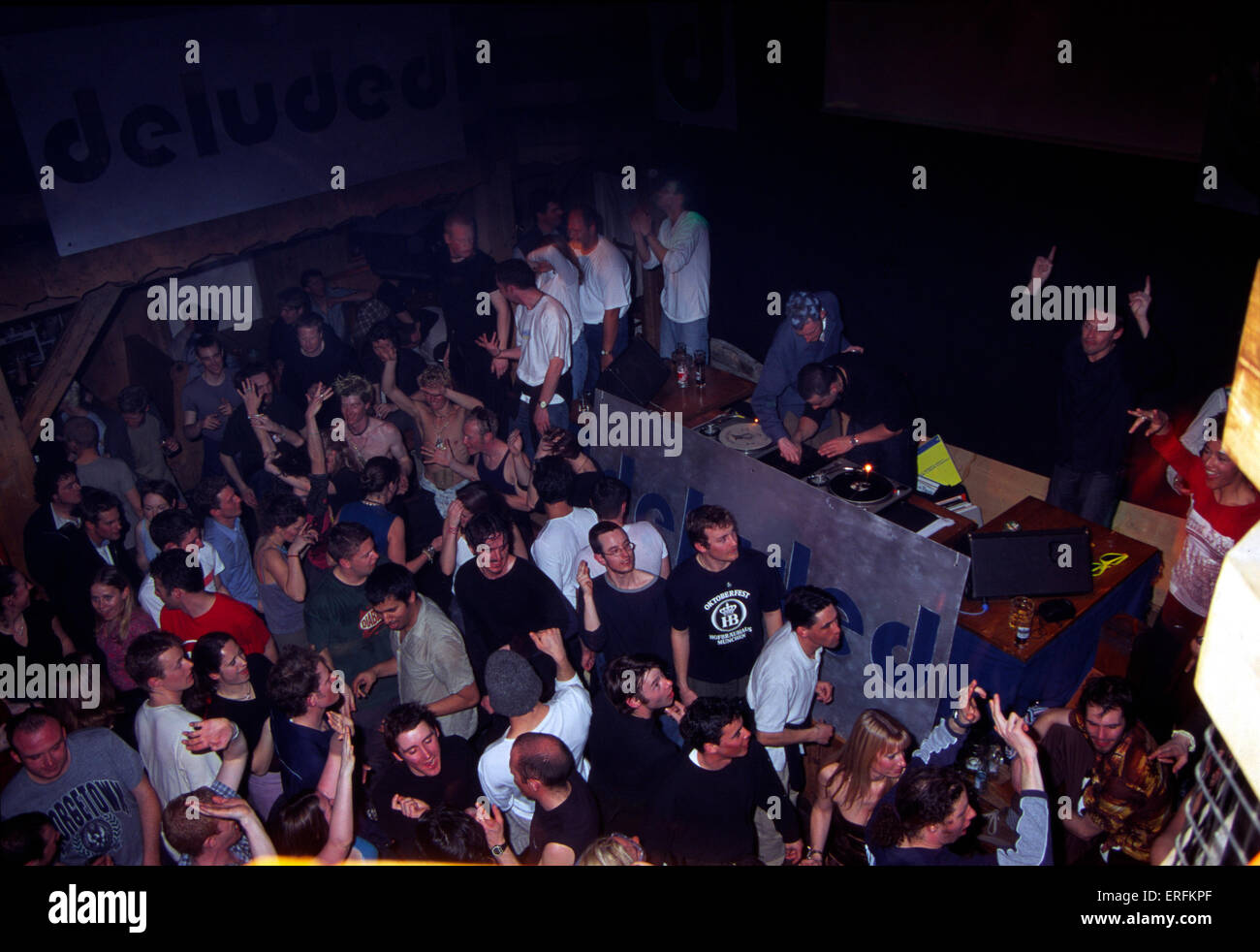 Disco - young people dancing in a club to the DJ 's music, 2001. View ...