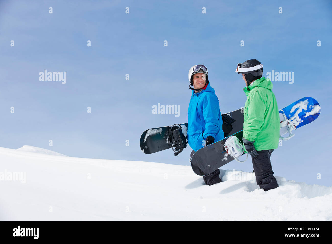 Two Men With Snowboards On Ski Holiday In Mountains Stock Photo - Alamy