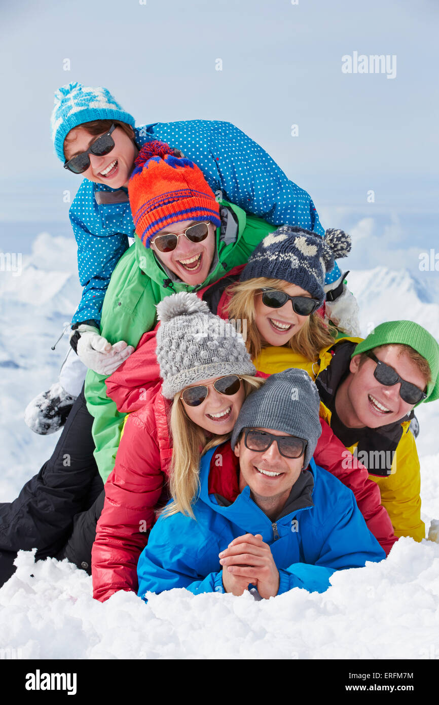 Group Of Friends Having Fun On Ski Holiday In Mountains Stock Photo - Alamy