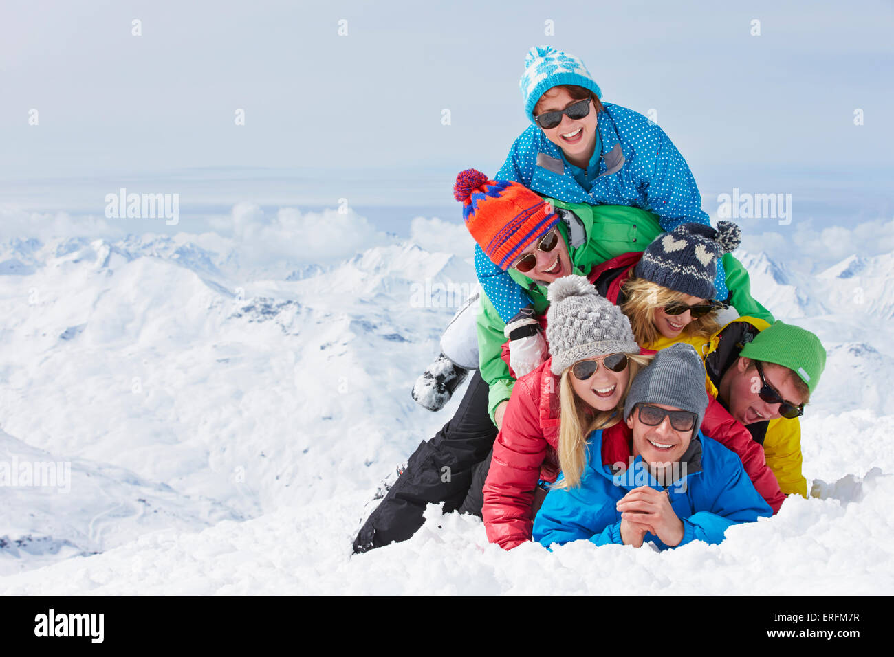 Group Of Friends Having Fun On Ski Holiday In Mountains Stock Photo - Alamy