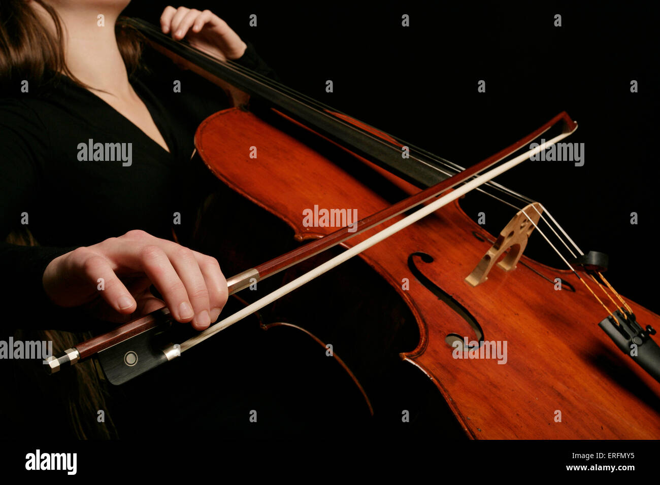 Cello - woman in playing position, cellist Stock Photo - Alamy
