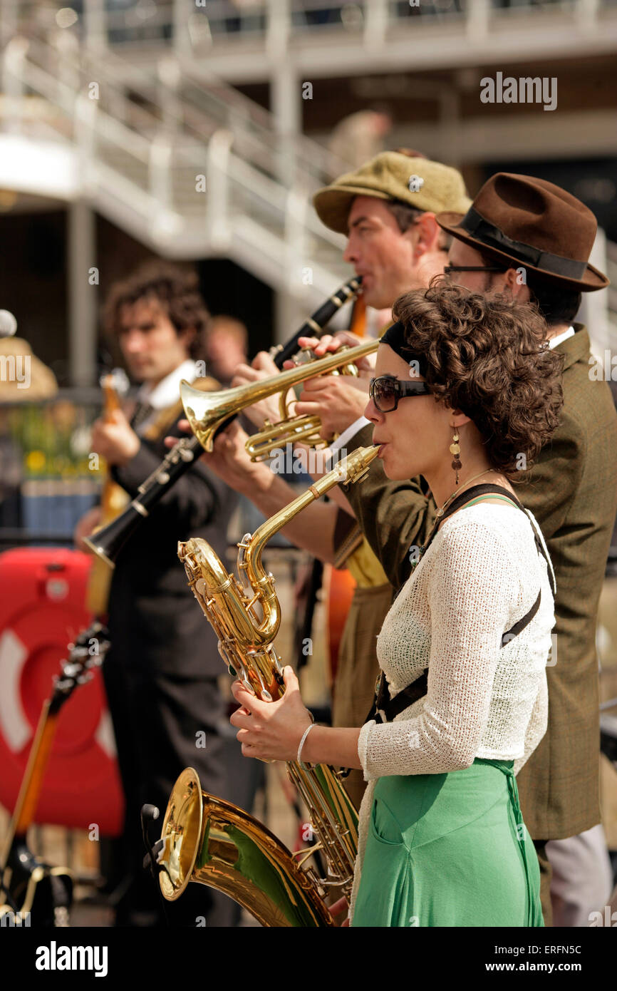 Jazz group - performing in the street, with baritone saxophone in the ...
