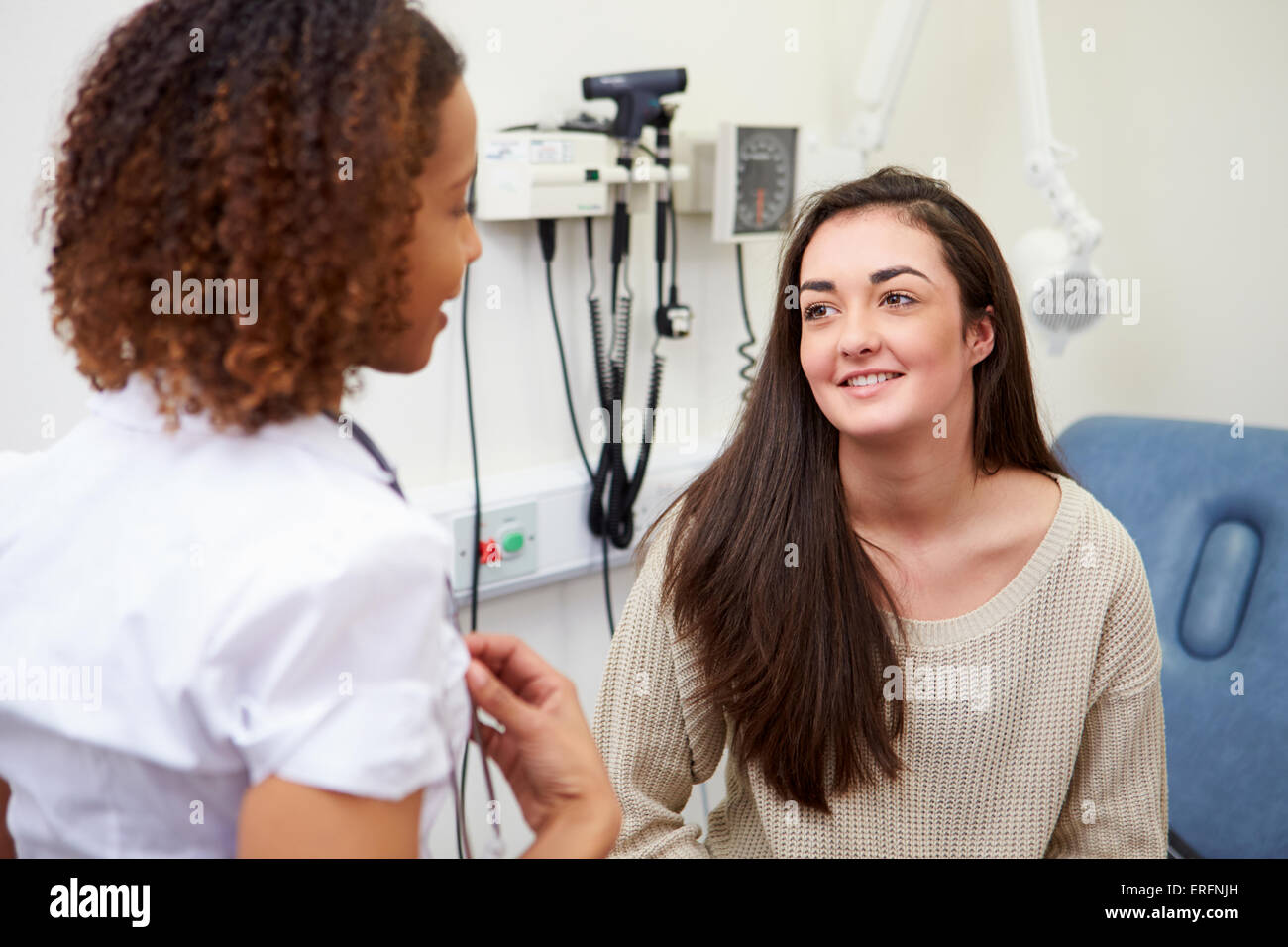 Female Consultant Talking To Teenage Patient In Hospital Stock Photo ...