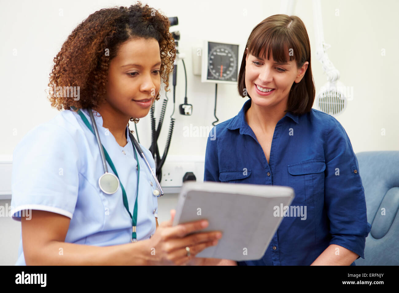Nurse Showing Patient Test Results On Digital Tablet Stock Photo - Alamy