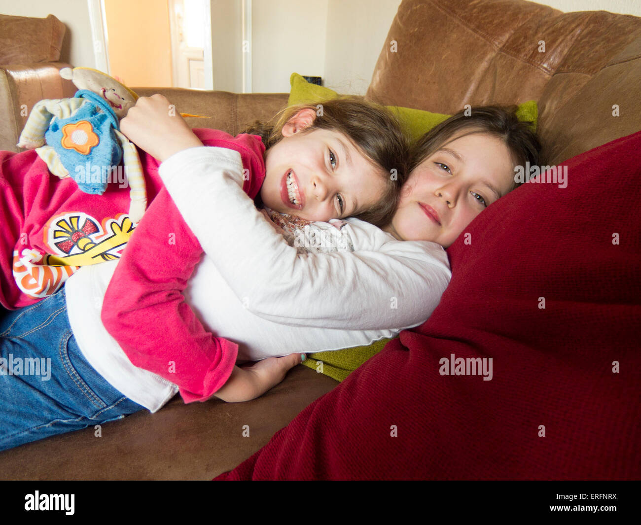 Siblings hugging hi-res stock photography and images - Alamy