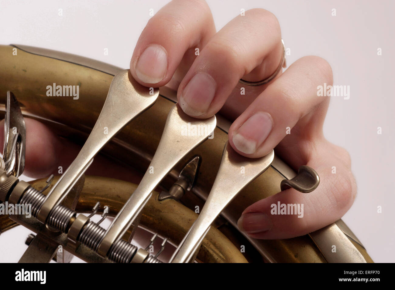 French Horn players fingers in playing position on valve levers Stock ...