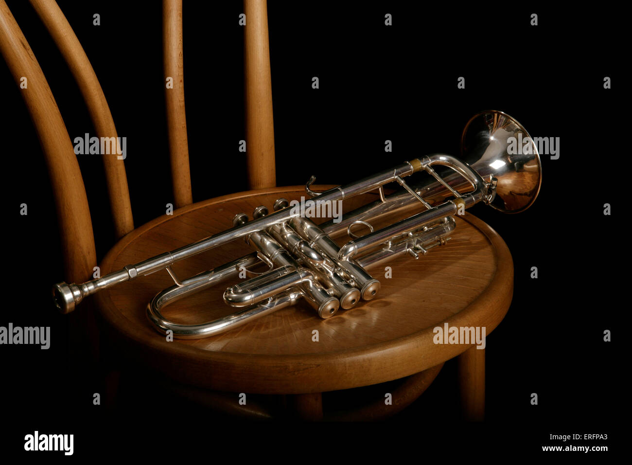 Trumpet on a chair Stock Photo - Alamy