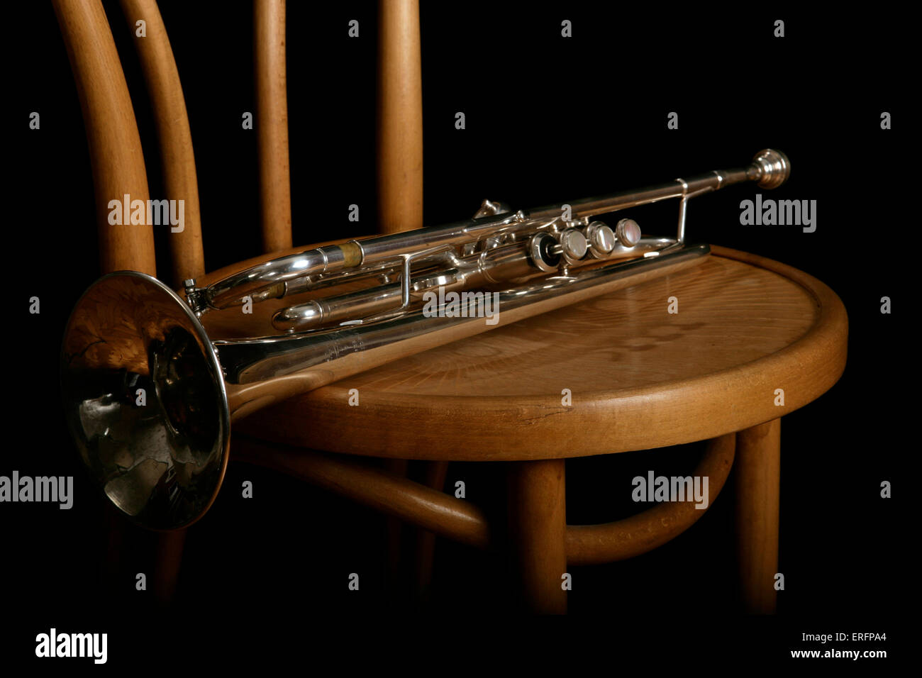 Trumpet on a chair Stock Photo - Alamy