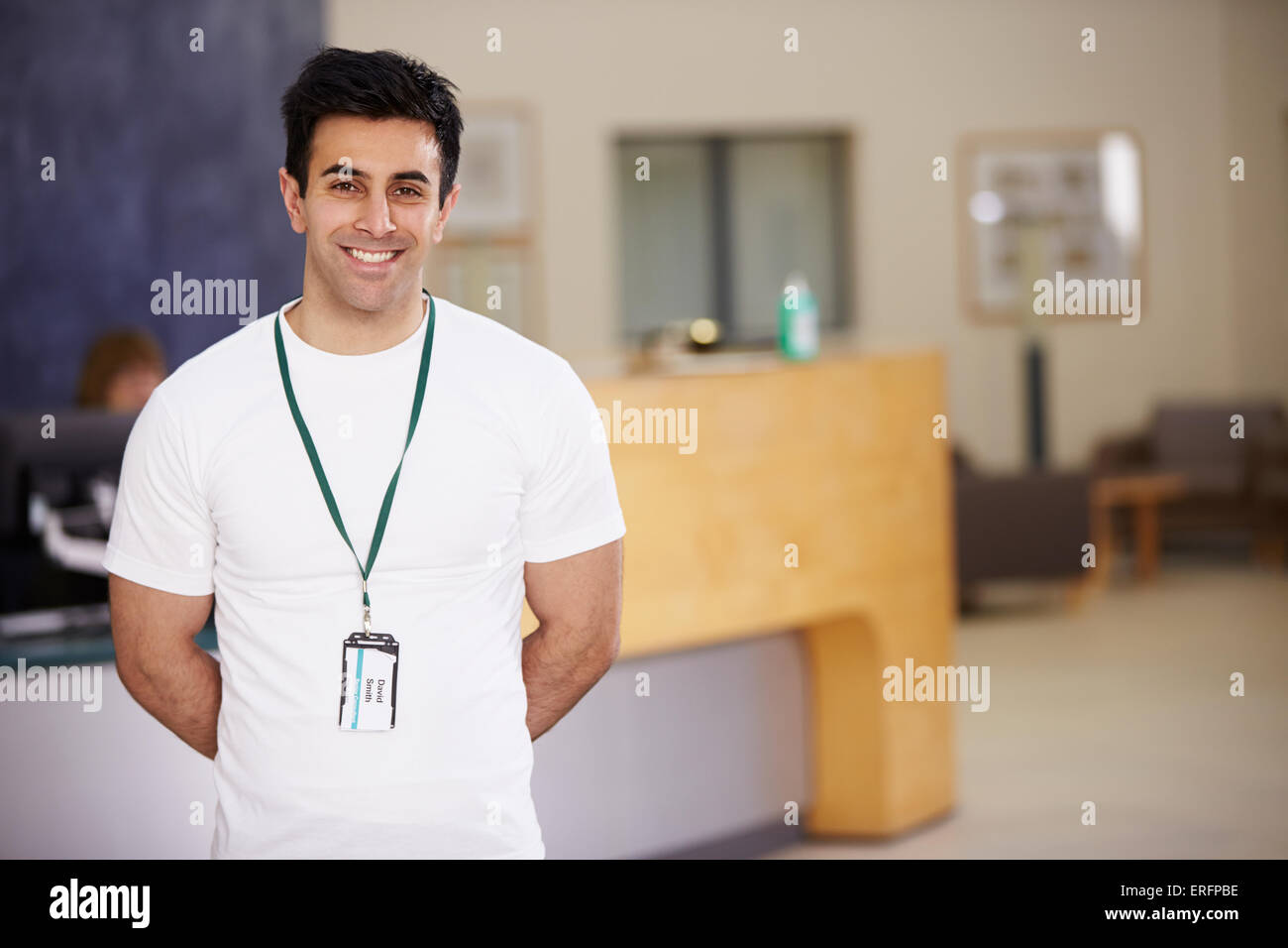 Portrait Of Male Physiotherapist In Hospital Reception Stock Photo - Alamy