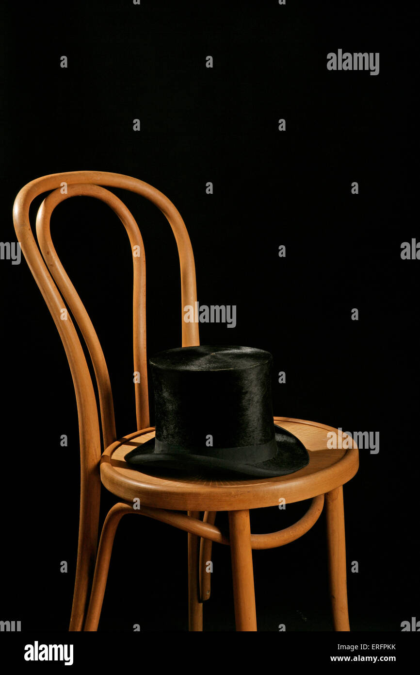 Top hat on a wooden chair Stock Photo - Alamy