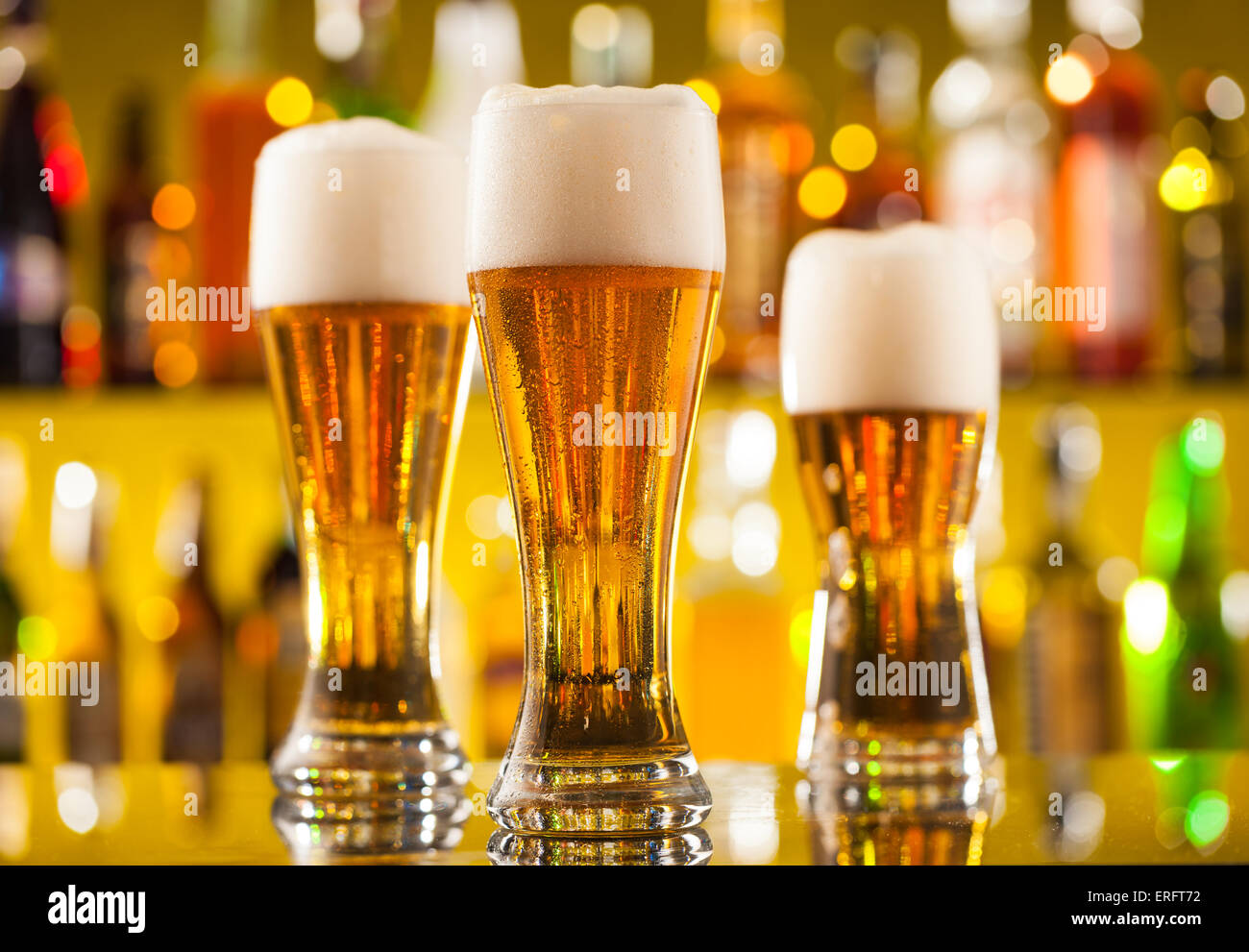 Jugs of beer placed on bar counter with copyspace Stock Photo - Alamy