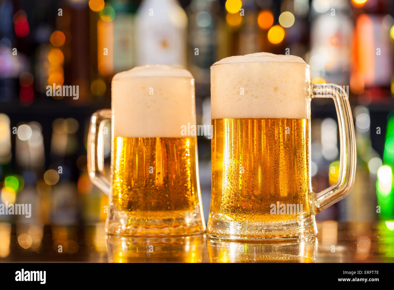 Jugs of beer placed on bar counter with copyspace Stock Photo - Alamy