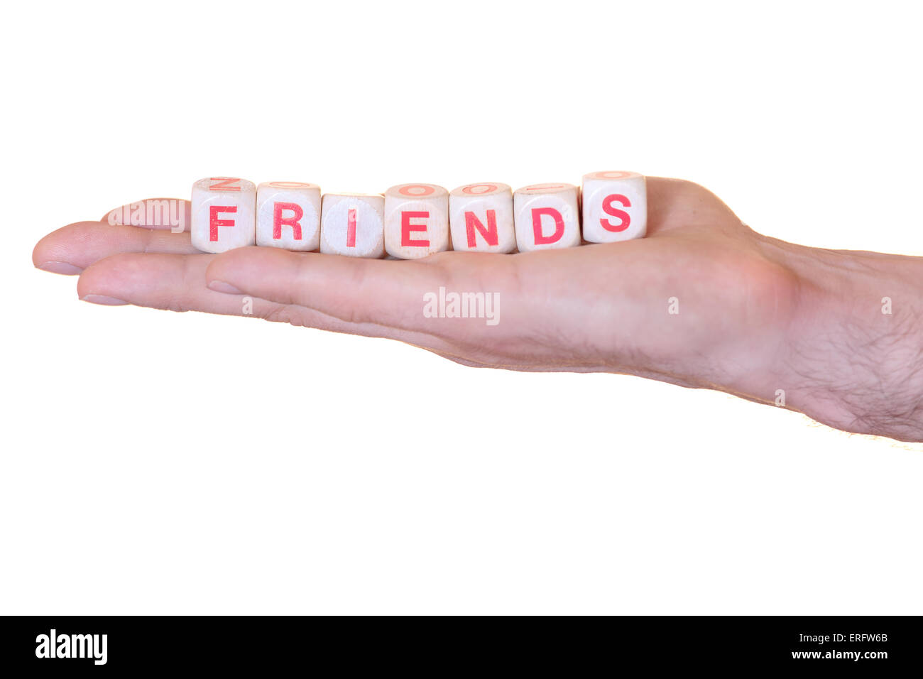 The word friends written with wooden dice on the he palm of the hand ...