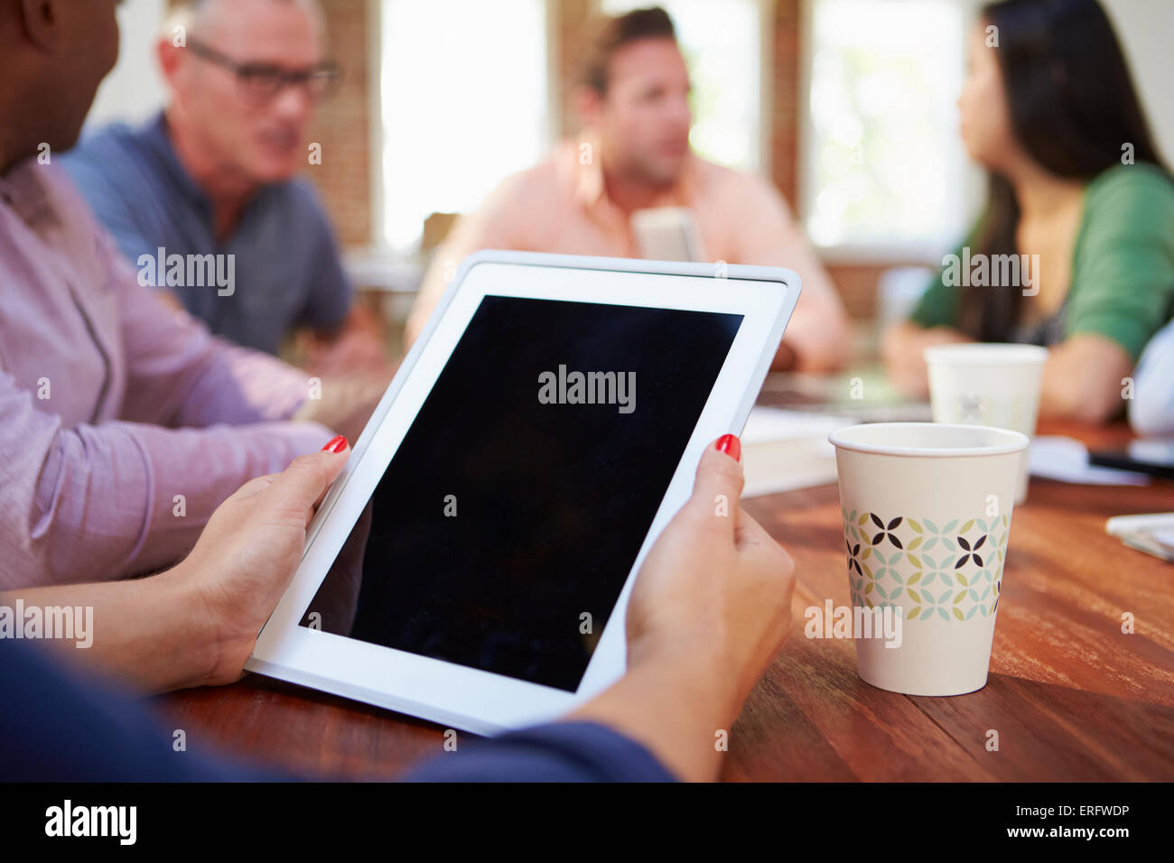 Business people talking using tablet hi-res stock photography and ...