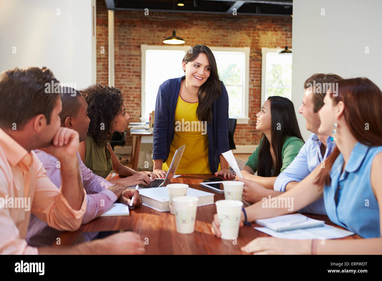 Female Boss Addressing Office Workers At Meeting Stock Photo - Alamy