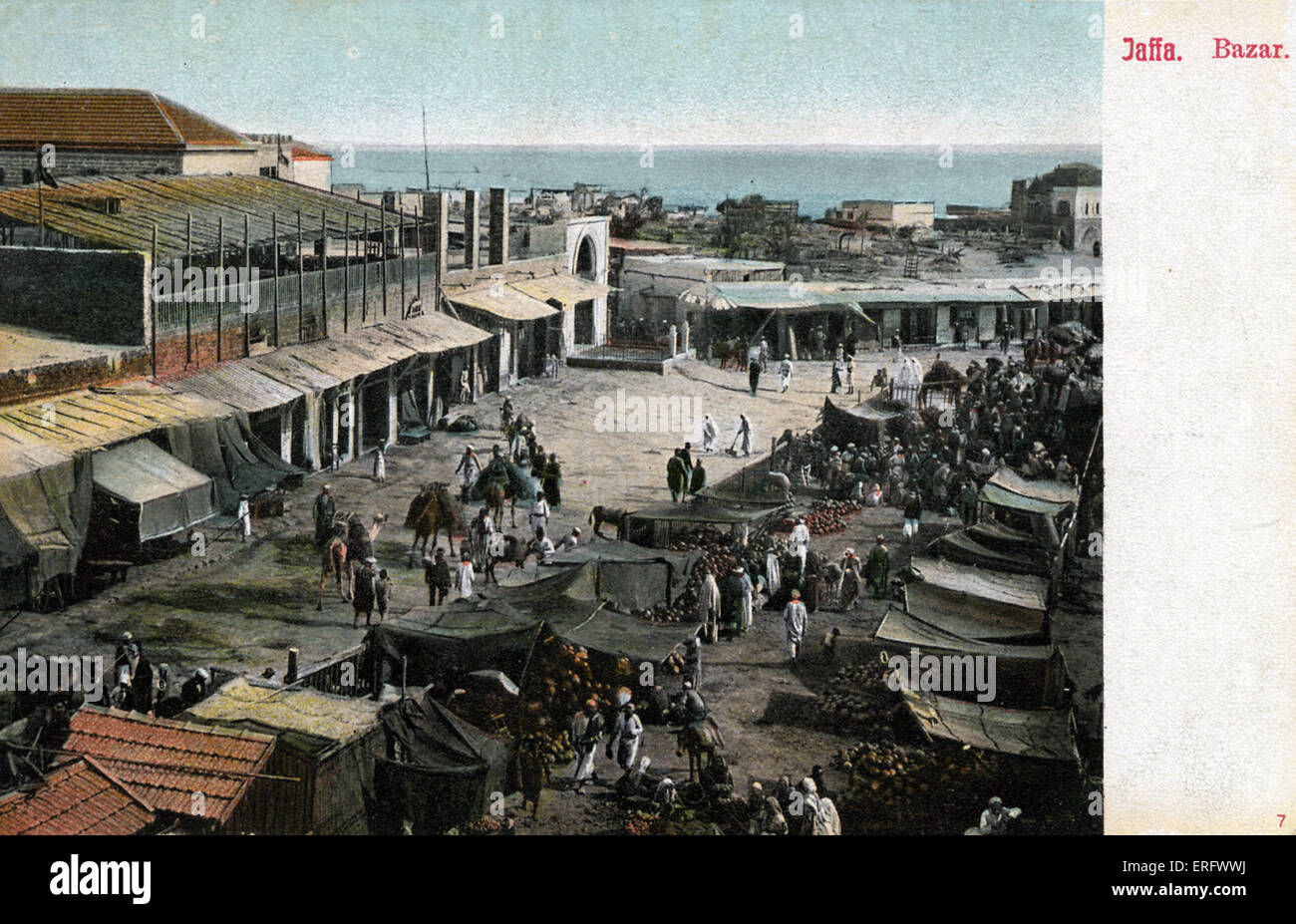 Jaffa market with tent stalls and Arab men shopping. Late 1800s, early ...