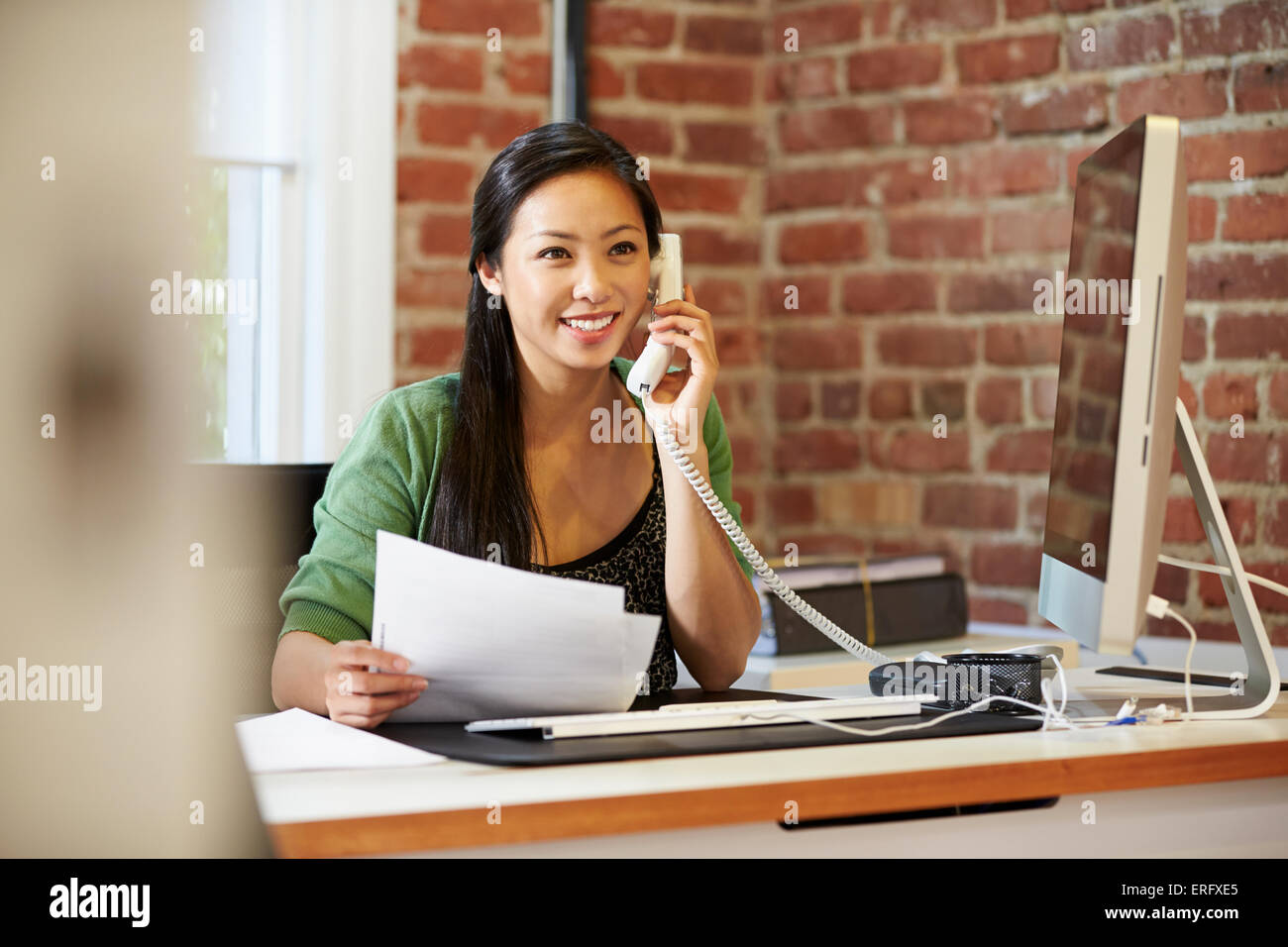 Woman Working At Computer In Contemporary Office Stock Photo - Alamy