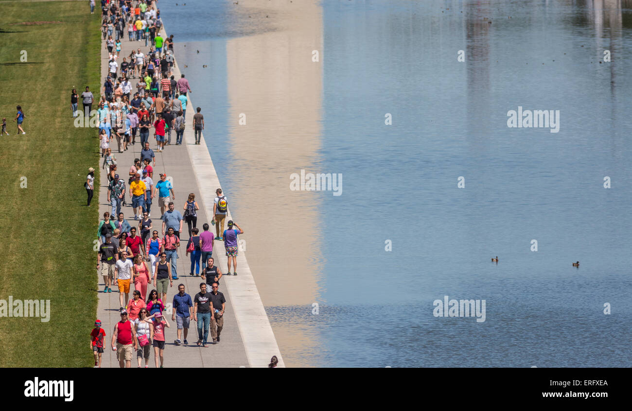 WASHINGTON, DC, USA - People walk along reflecting pool on National ...