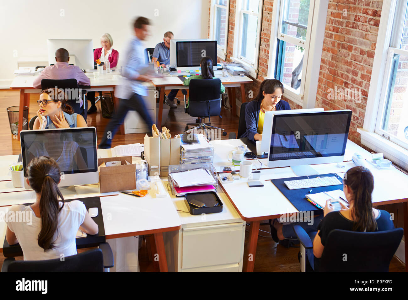 Wide Angle View Of Busy Design Office With Workers At Desks Stock Photo ...