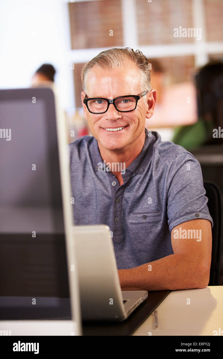 Man Working At Computer In Contemporary Office Stock Photo - Alamy