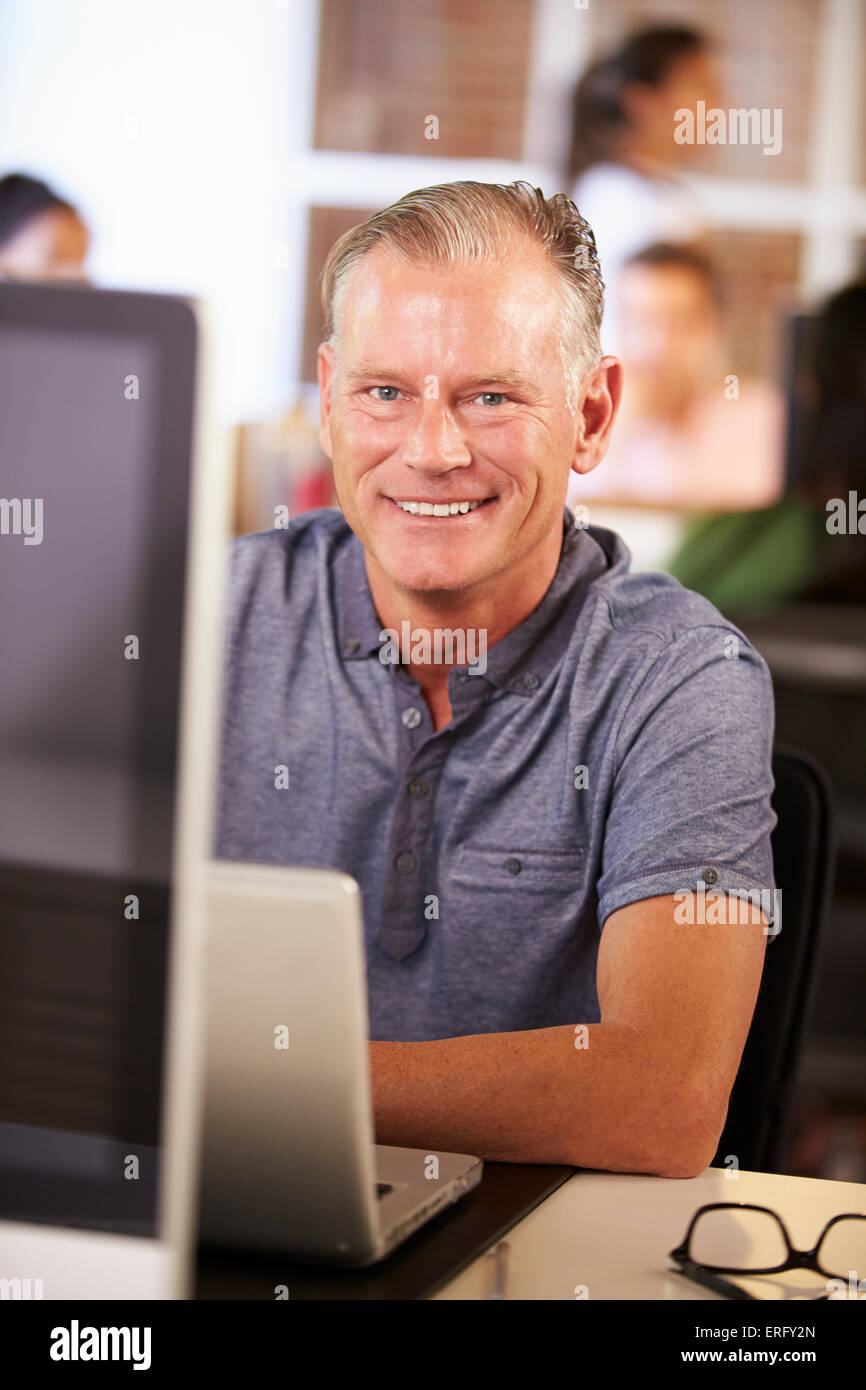 Man Working At Computer In Contemporary Office Stock Photo - Alamy
