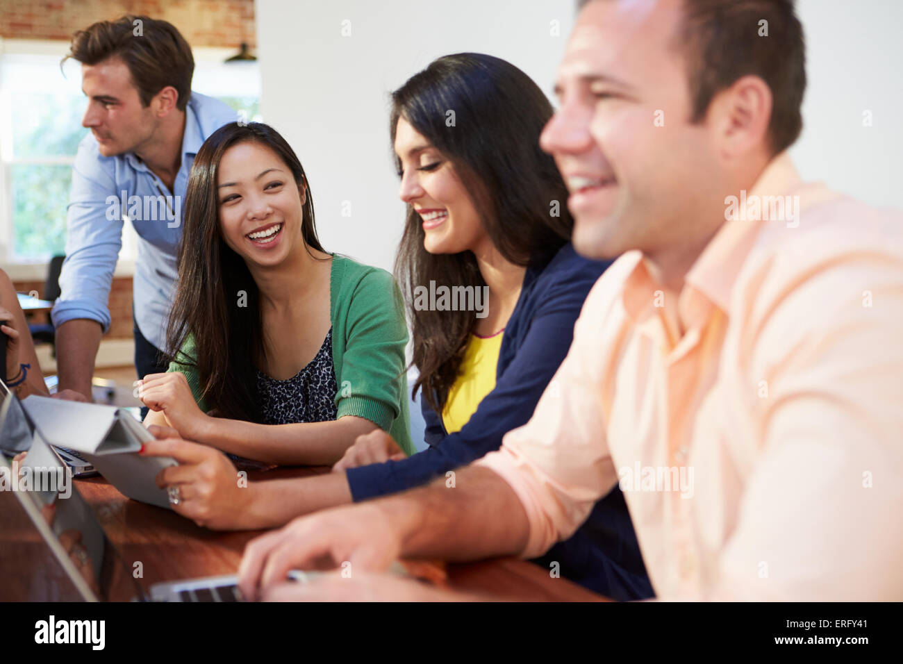 Businessmen And Businesswomen Meeting To Discuss Ideas Stock Photo - Alamy