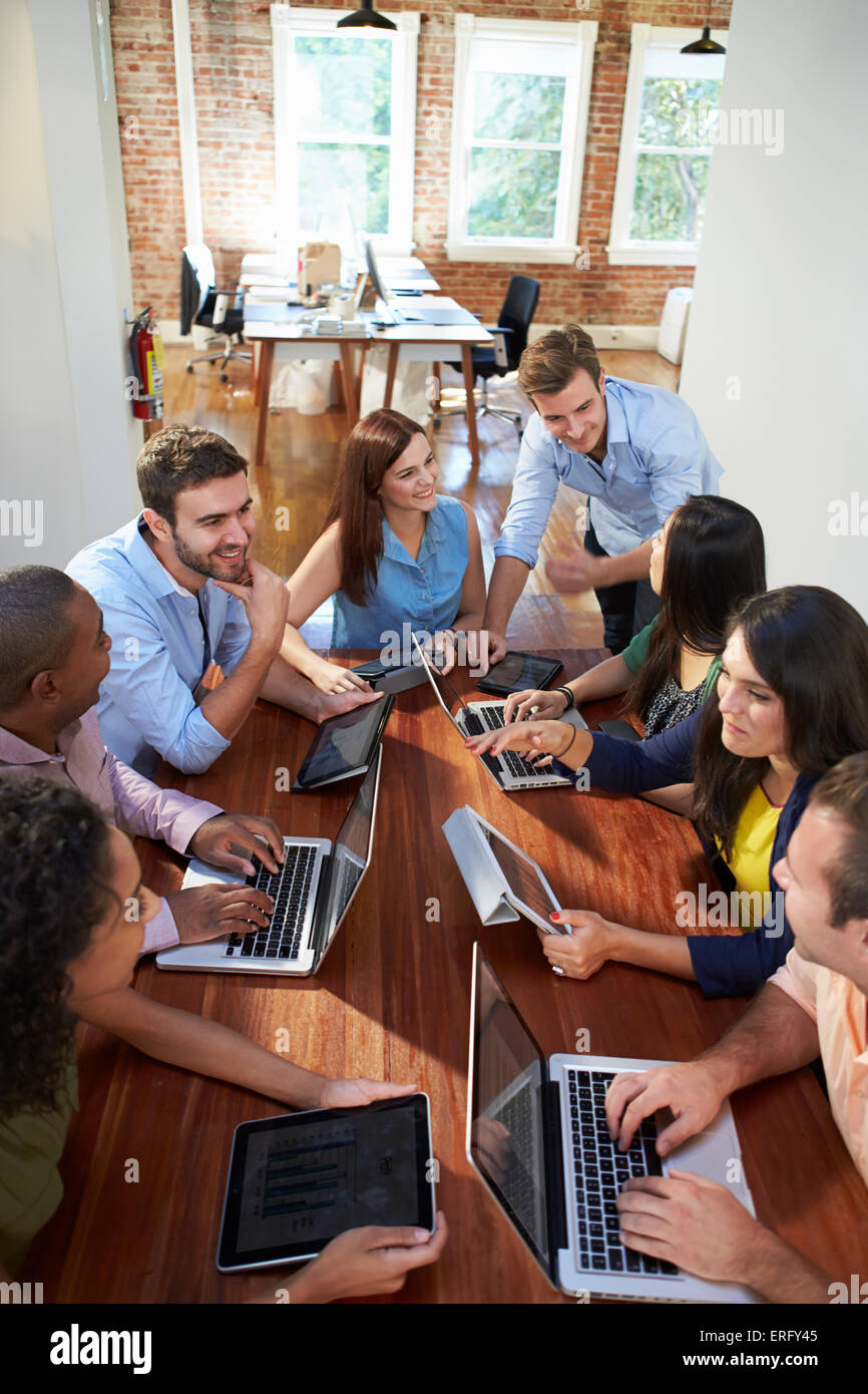 Group Of Office Workers Meeting To Discuss Ideas Stock Photo - Alamy