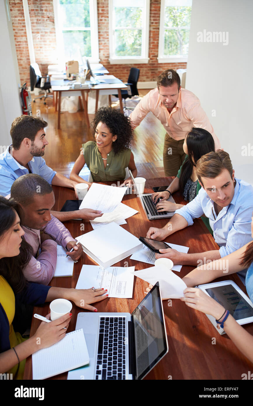 Group Of Office Workers Meeting To Discuss Ideas Stock Photo - Alamy