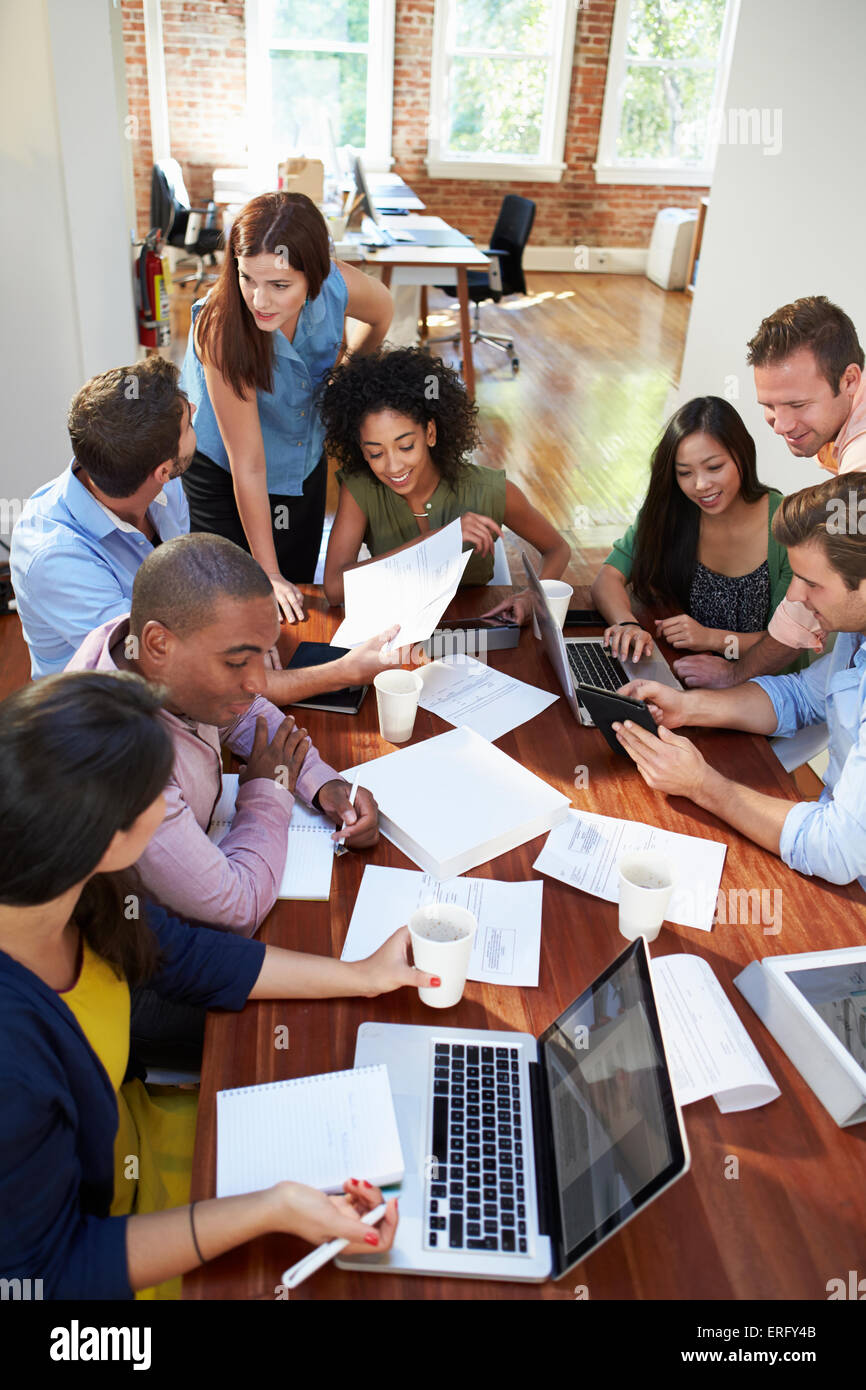 Group Of Office Workers Meeting To Discuss Ideas Stock Photo - Alamy