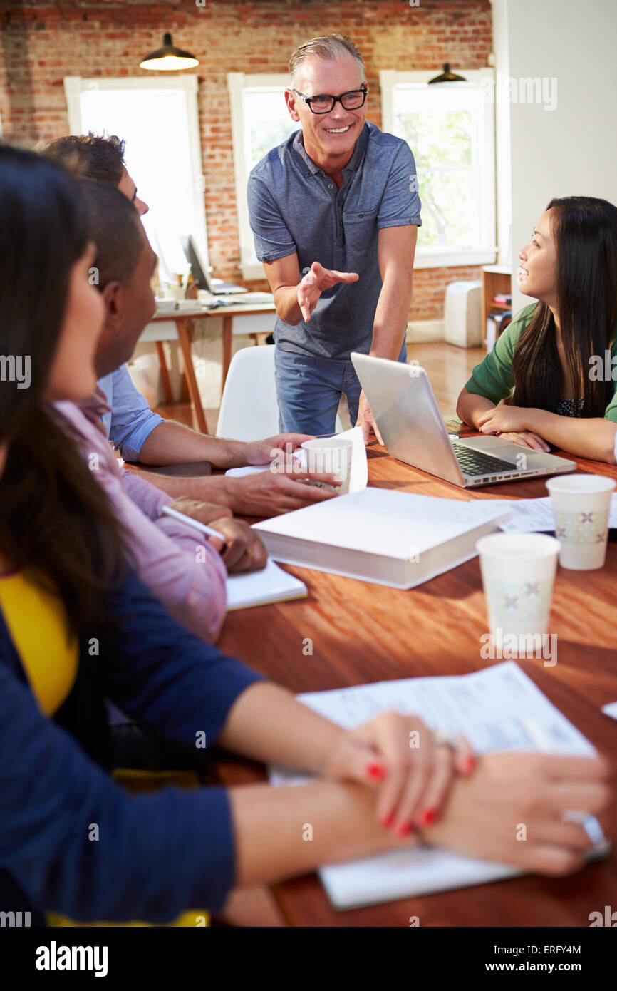 Group Of Office Workers Meeting To Discuss Ideas Stock Photo - Alamy
