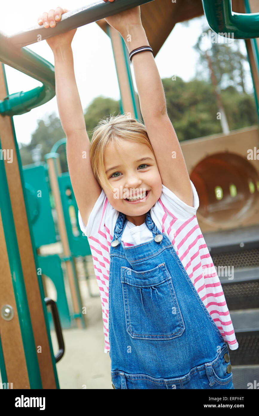 Young Girl On Climbing Frame In Playground Stock Photo - Alamy