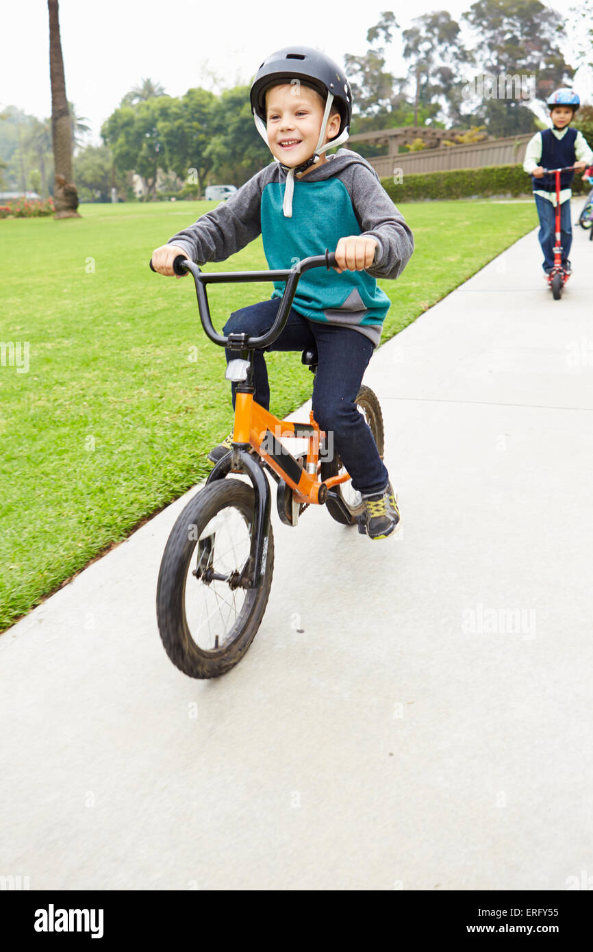 Young Boy Riding Bike In Park Stock Photo - Alamy