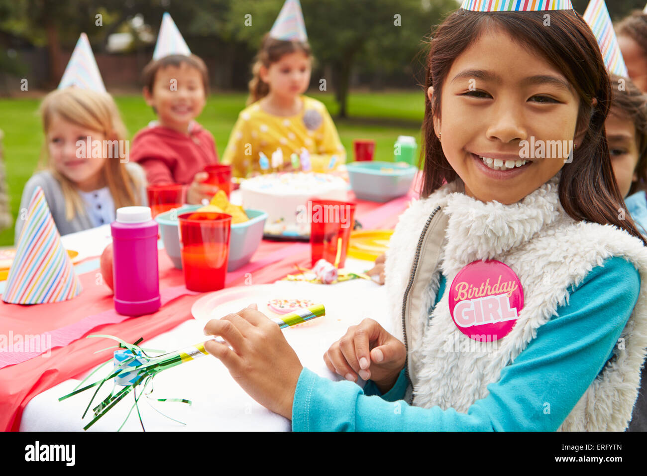 Group Of Children Having Outdoor Birthday Party Stock Photo - Alamy