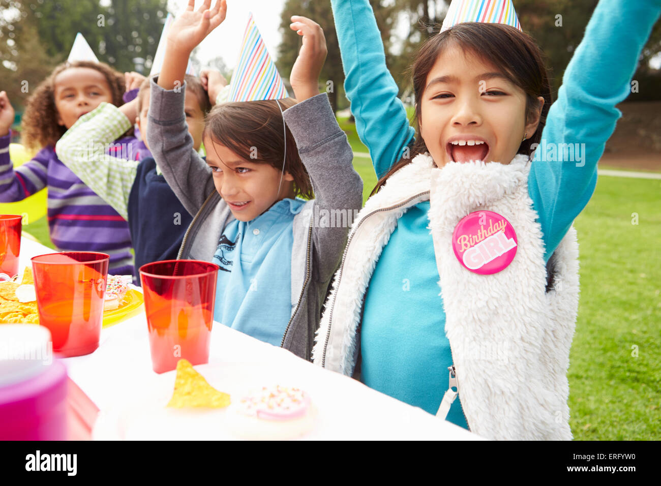 Group Of Children Having Outdoor Birthday Party Stock Photo - Alamy