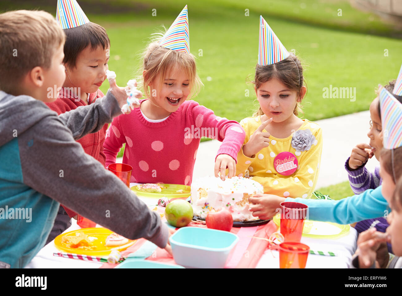 Group Of Children Having Outdoor Birthday Party Stock Photo - Alamy