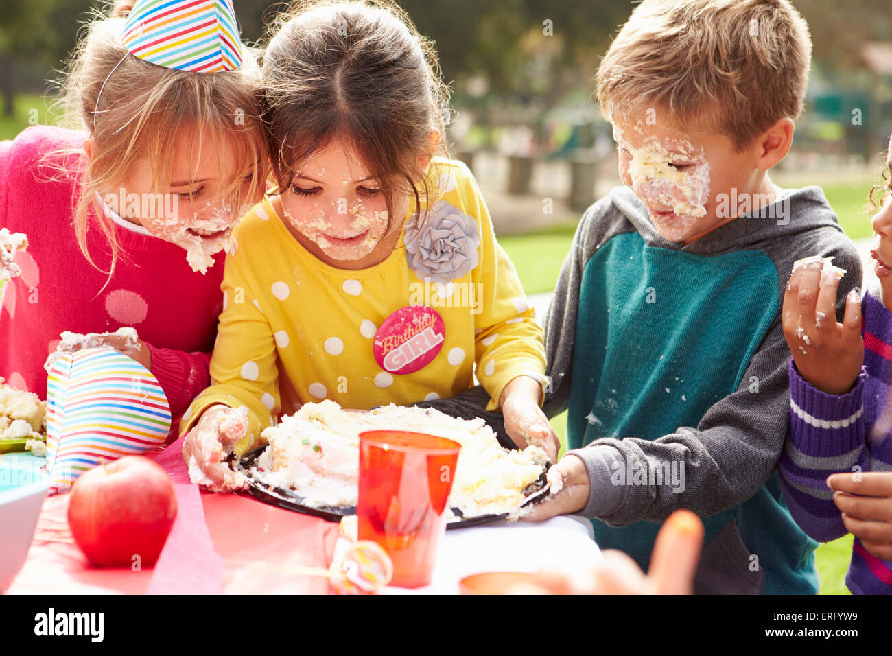 Group Of Children Having Outdoor Birthday Party Stock Photo - Alamy