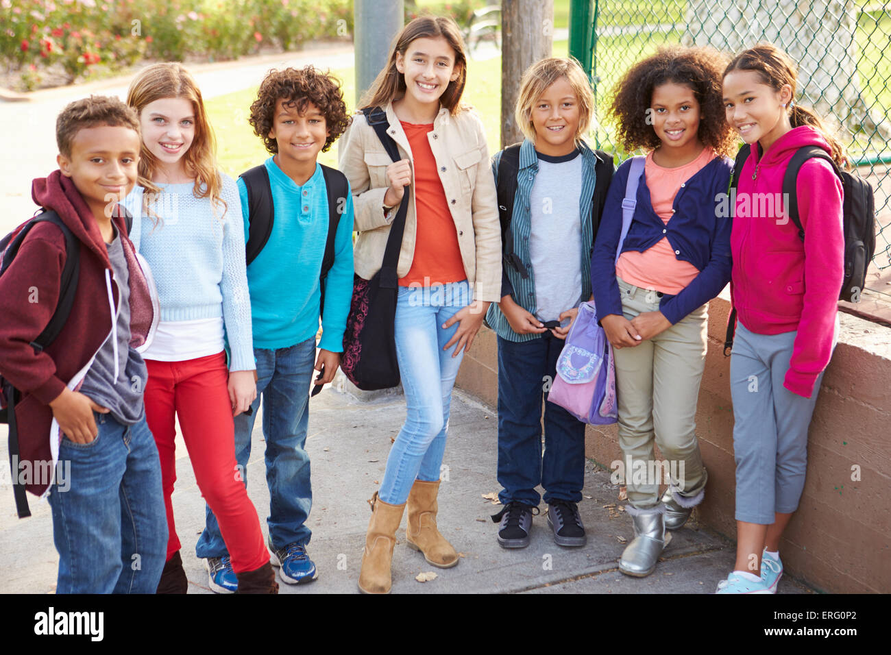 Group Of Young Children Hanging Out In Playground Stock Photo - Alamy