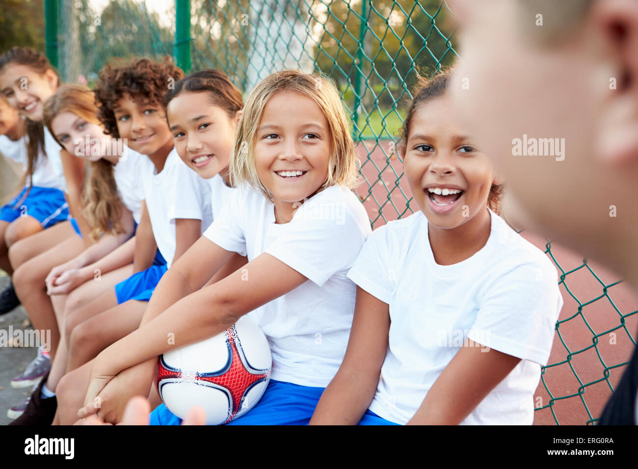 Youth Football Team Training With Coach Stock Photo - Alamy
