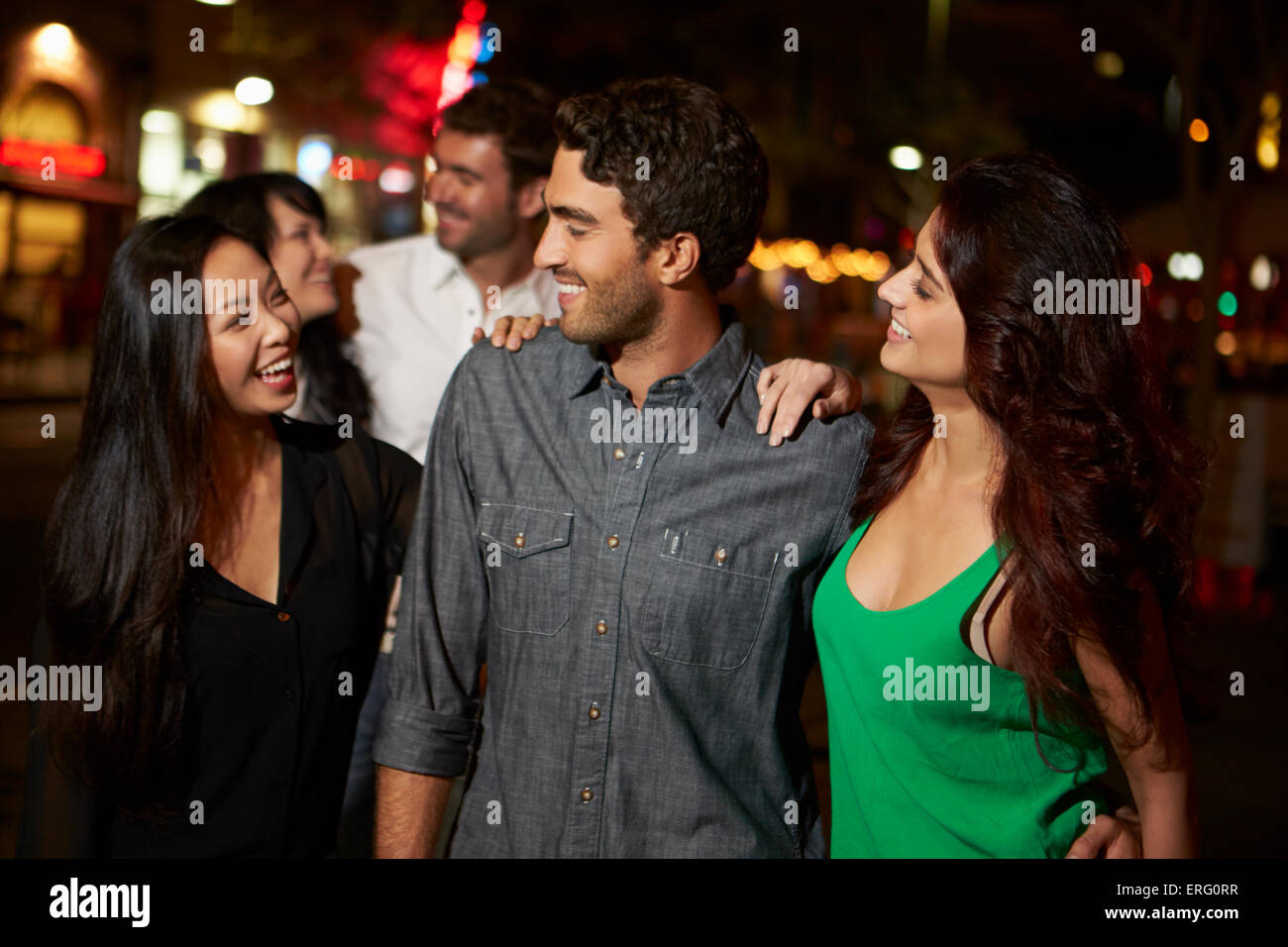 Group Of Friends Enjoying Night Out Together Stock Photo - Alamy