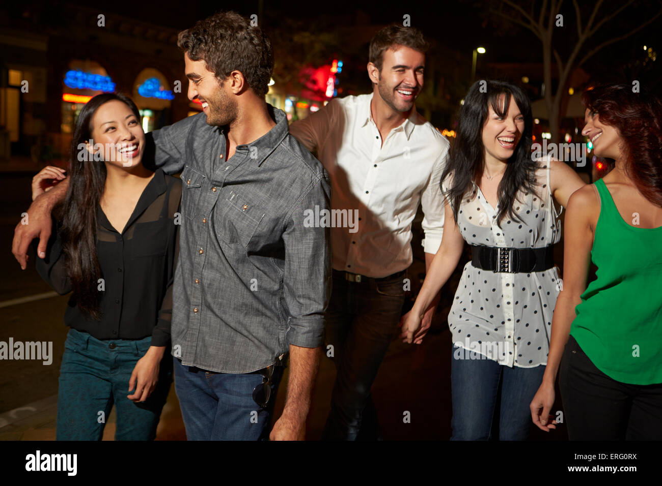 Group Of Friends Enjoying Night Out Together Stock Photo - Alamy