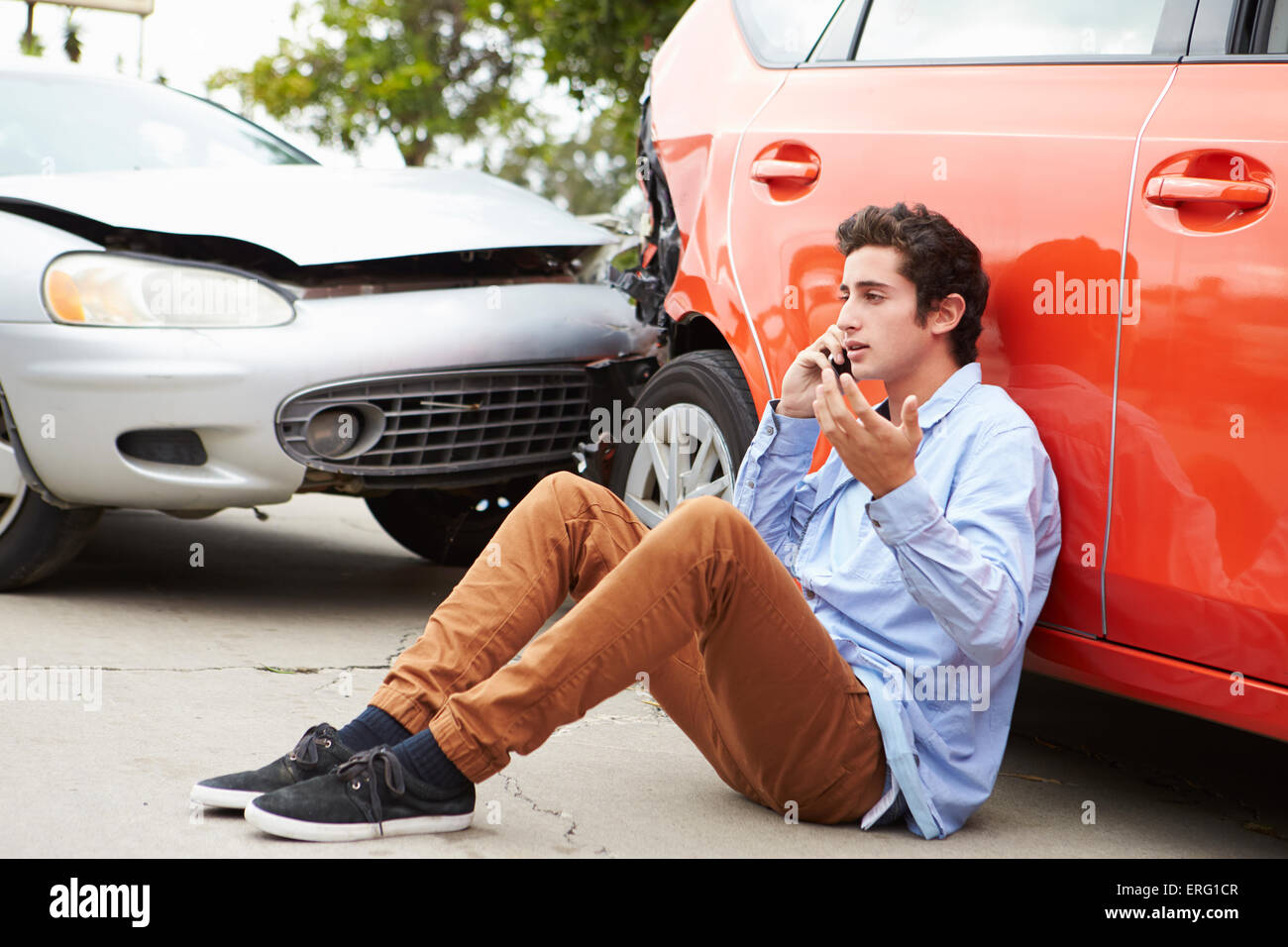 Teenage Driver Making Phone Call After Traffic Accident Stock Photo - Alamy