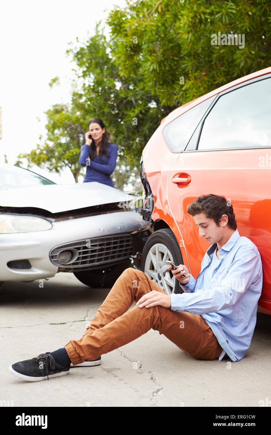Teenage Driver Making Phone Call After Traffic Accident Stock Photo - Alamy