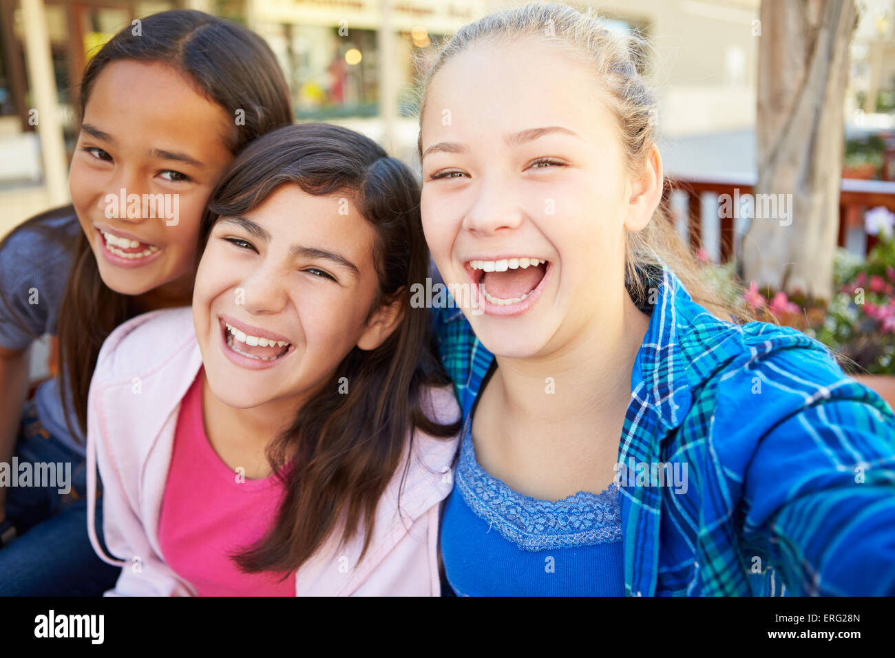 Group Of Girls Hanging Out In Mall Together Stock Photo - Alamy