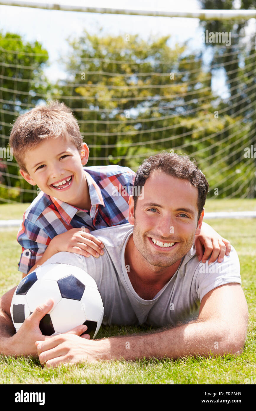 Portrait Of Father And Son With Football Stock Photo - Alamy