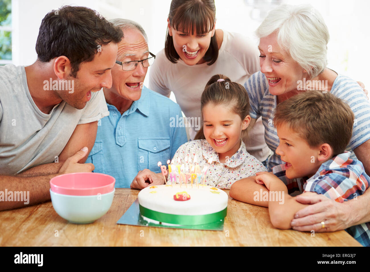Multi Generation Family Celebrating Daughter's Birthday Stock Photo - Alamy