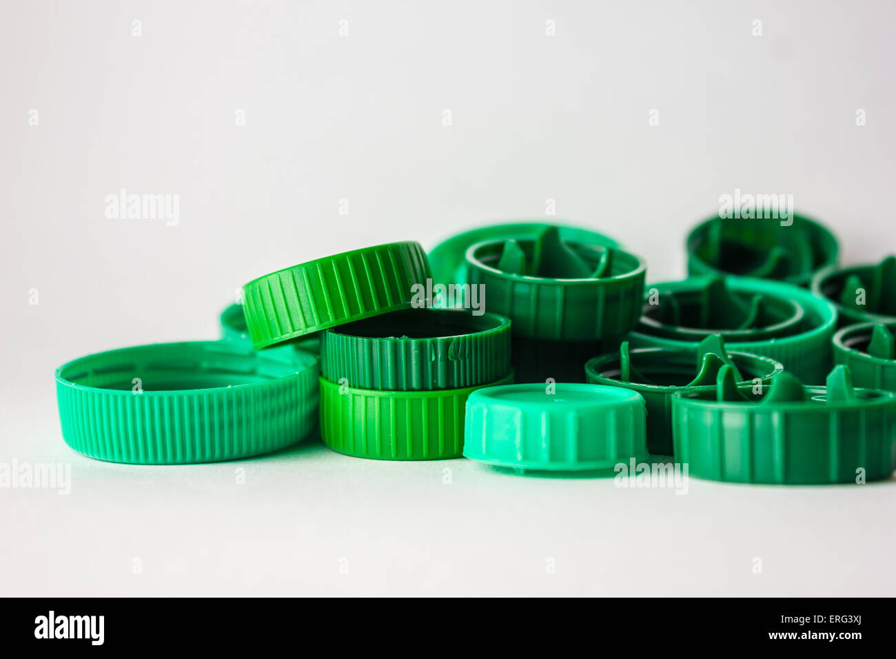 Colorful plastic caps isolated in white background Stock Photo - Alamy