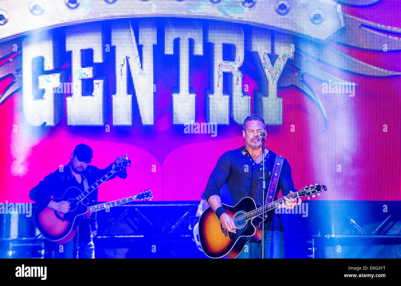 Eddie Montgomery and Troy Gentry of Montgomery Gentry perform on stage ...