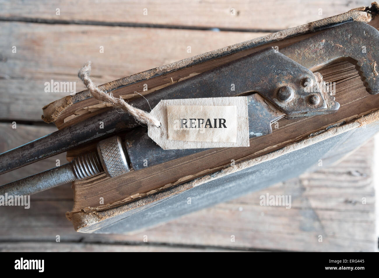 Repair word, book and wrench. Repair School concept Stock Photo - Alamy