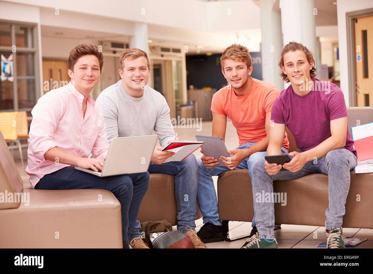 Male College Students Sitting And Talking Together Stock Photo - Alamy